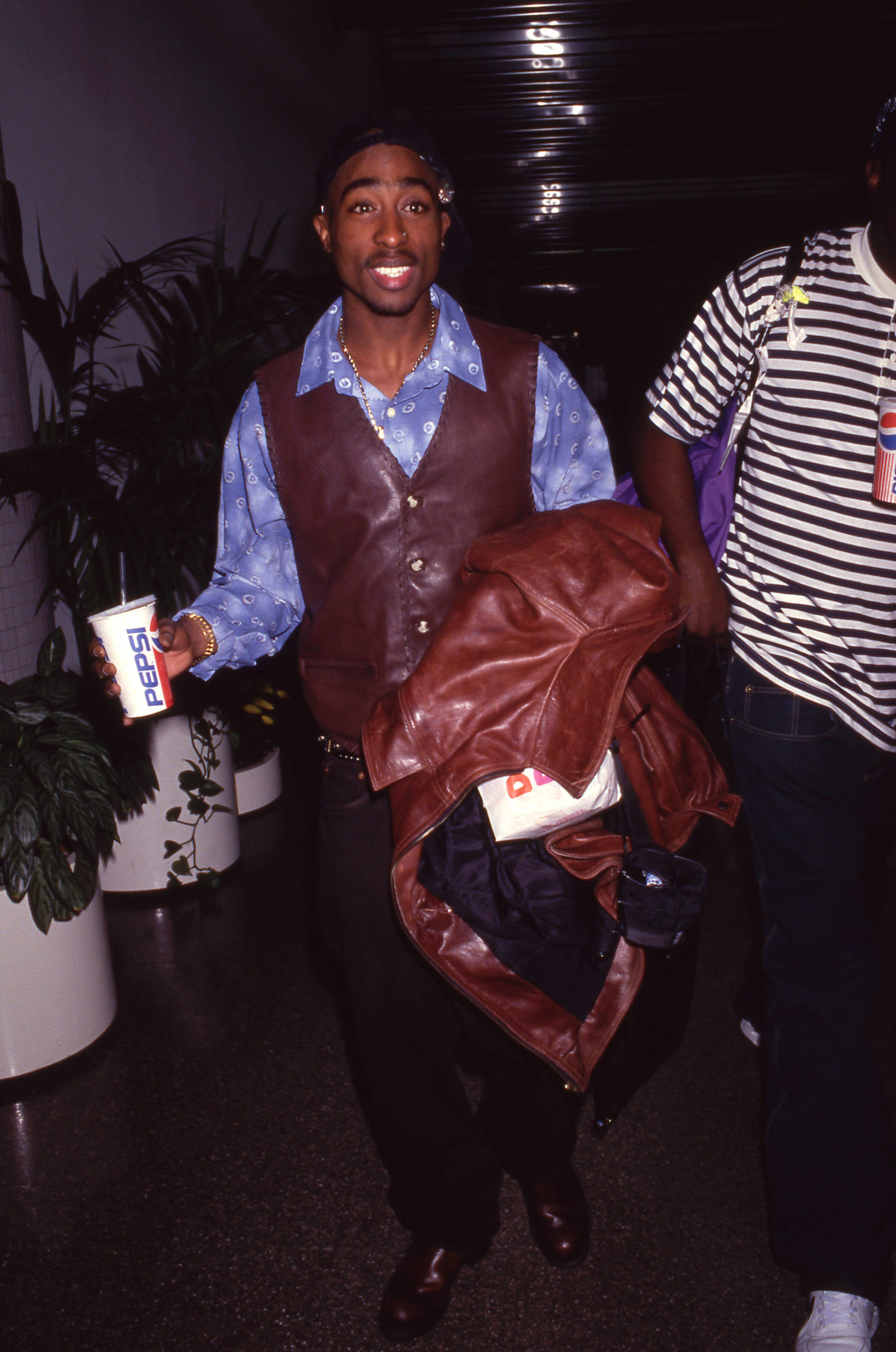 Poet and gangster: How Tupac Shakur became a rap, fashion and street ...